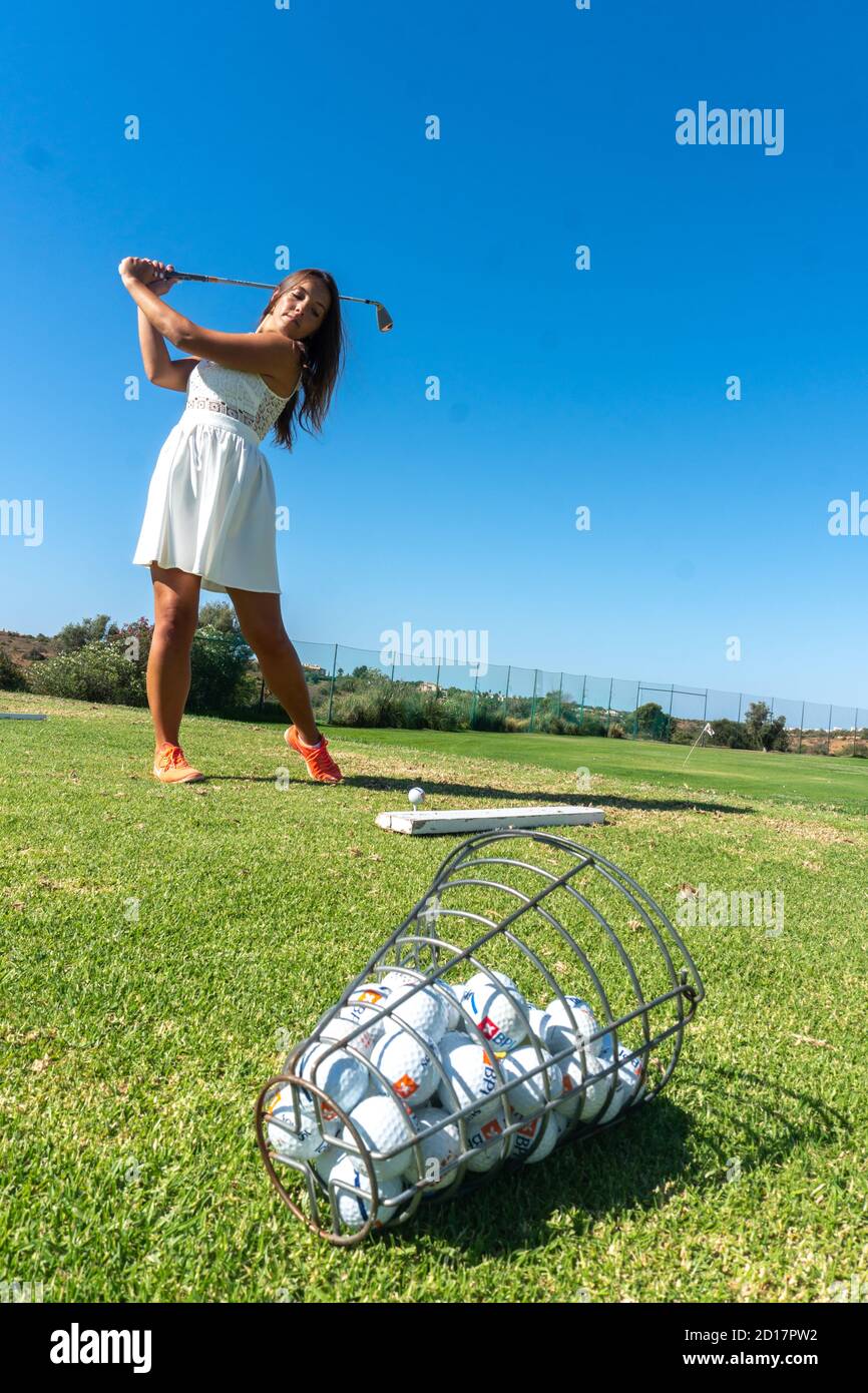 Lady playing golf hi-res stock photography and images - Alamy