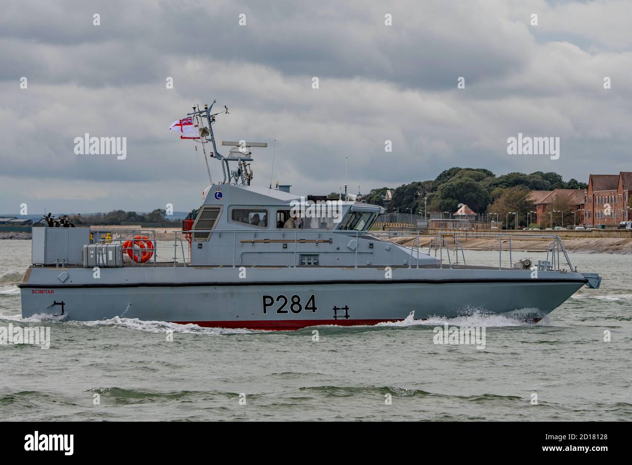 The Royal Navy fast patrol boat HMS Scimitar (P284) arriving at ...