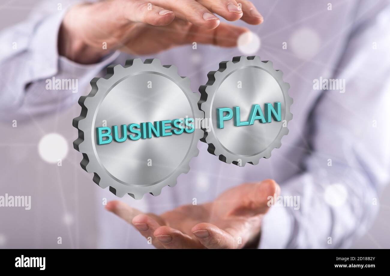 Business plan concept between hands of a man in background Stock Photo ...