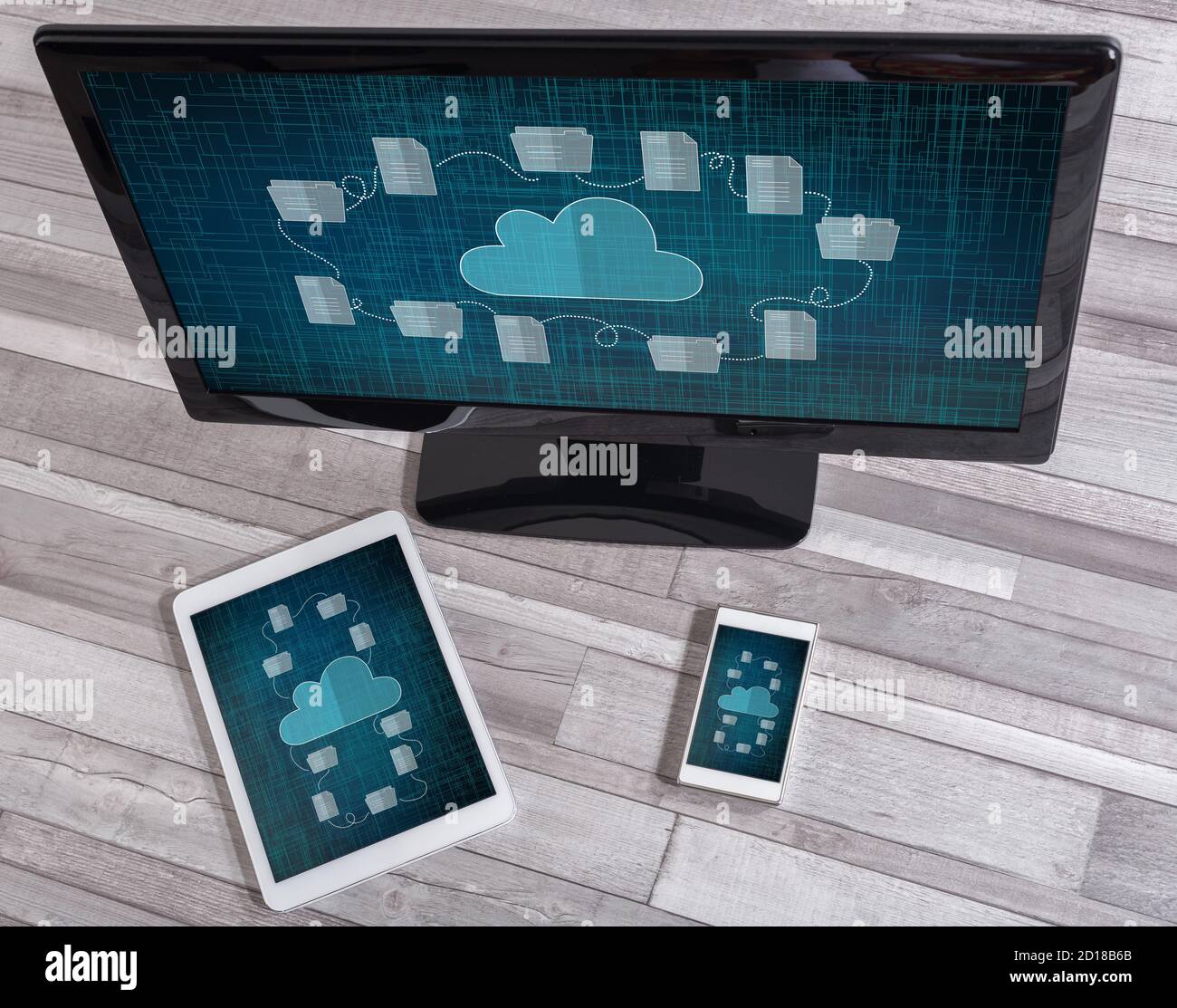 Cloud storage concept shown on different information technology devices ...