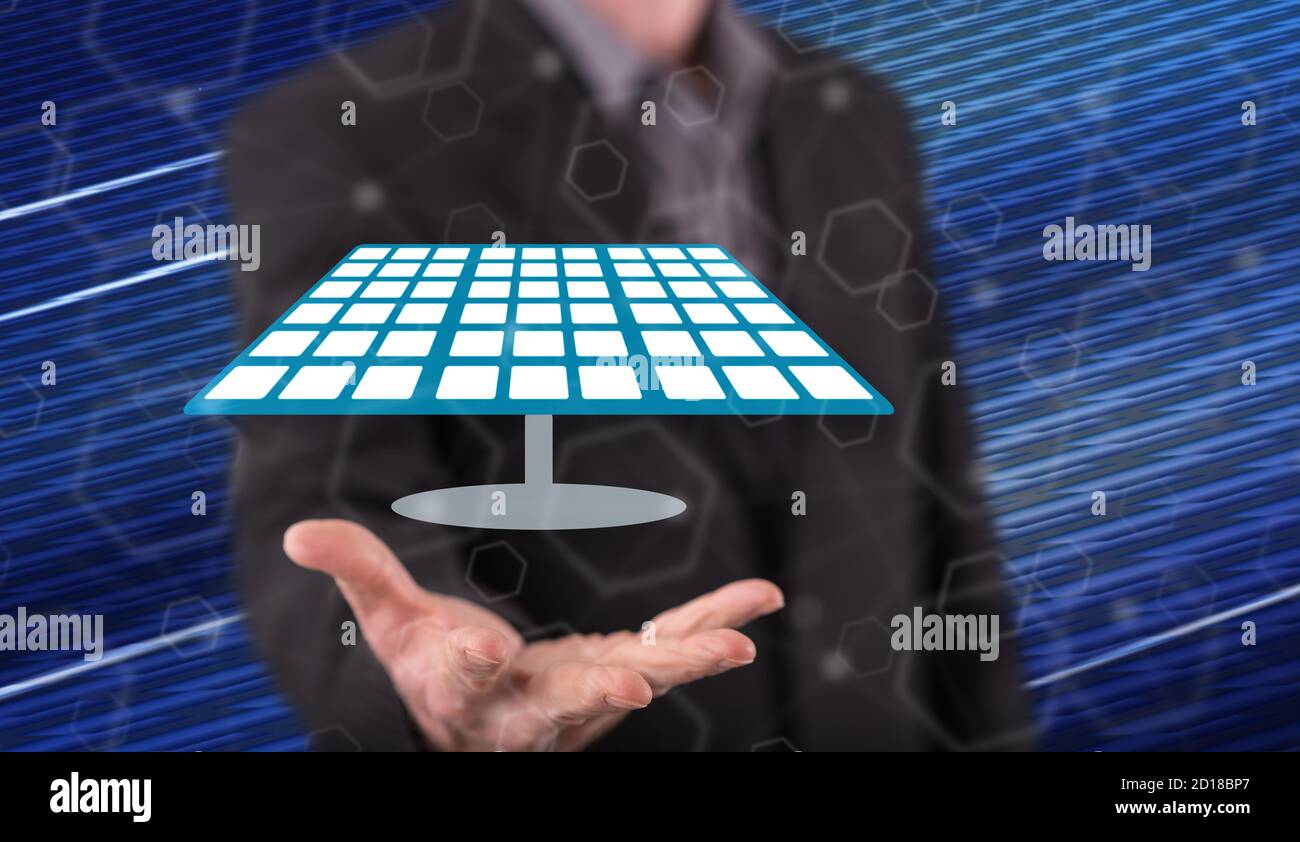 Clean energy concept above the hand of a man in background Stock Photo ...