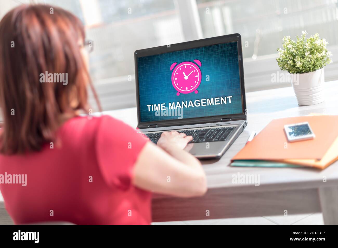 Laptop screen displaying a time management concept Stock Photo - Alamy