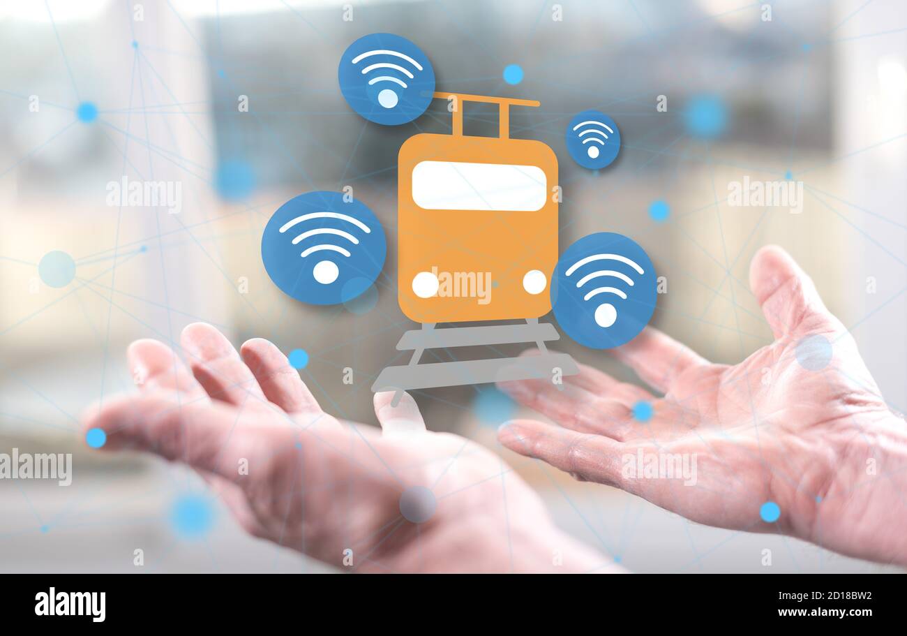 Smart train concept above the hands of a man Stock Photo - Alamy