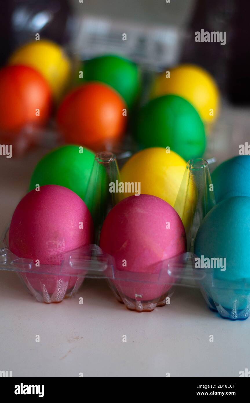 colored eggs in the egg tray Stock Photo - Alamy