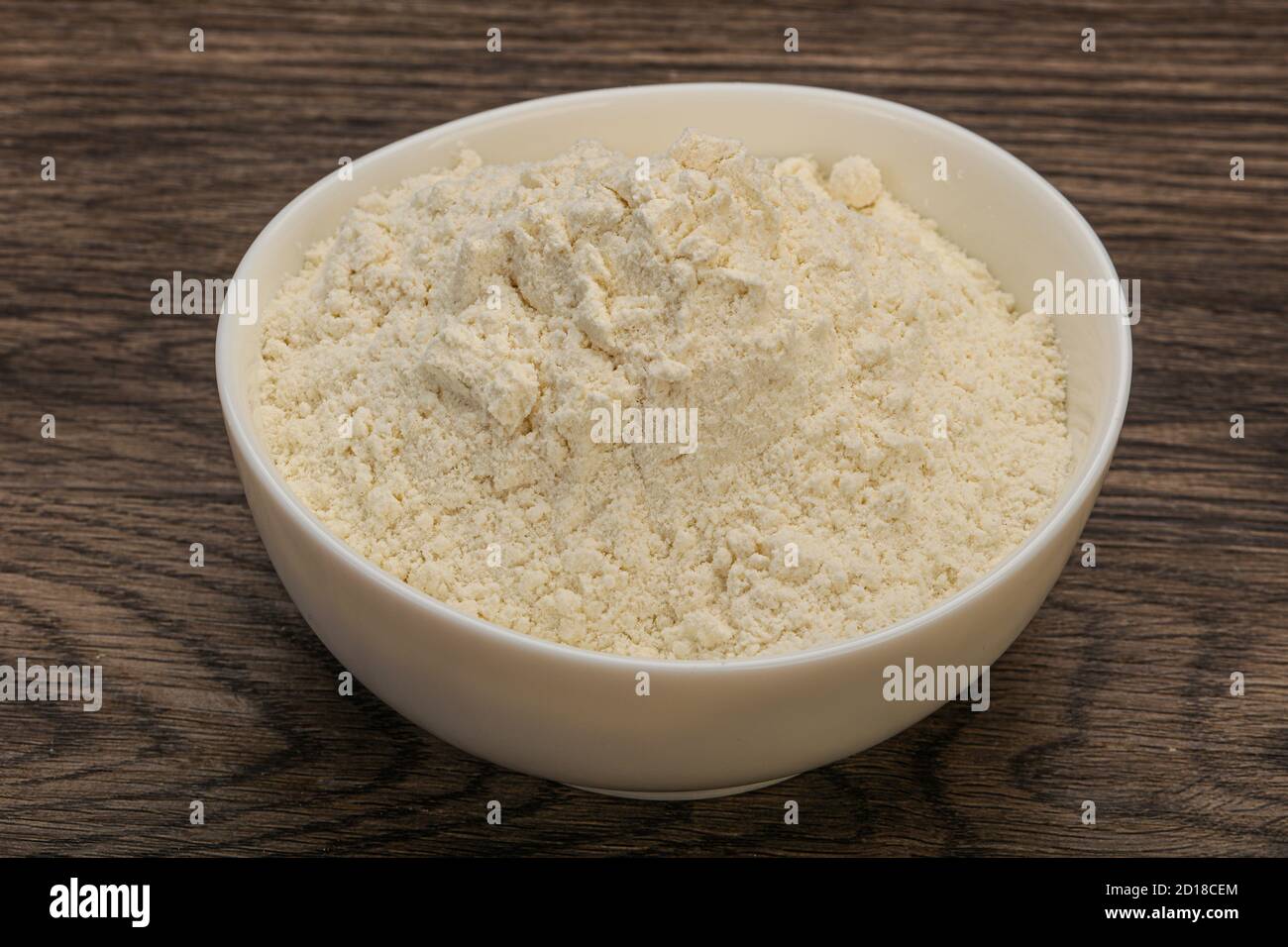 Wheat flour heap in the bowl for cooking Stock Photo - Alamy
