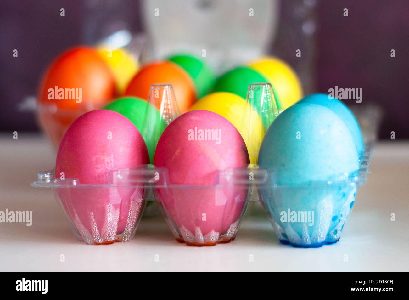 colored eggs in the egg tray Stock Photo - Alamy