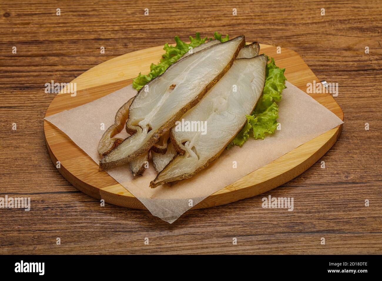Delicous smoked halibut fish slices snack Stock Photo - Alamy