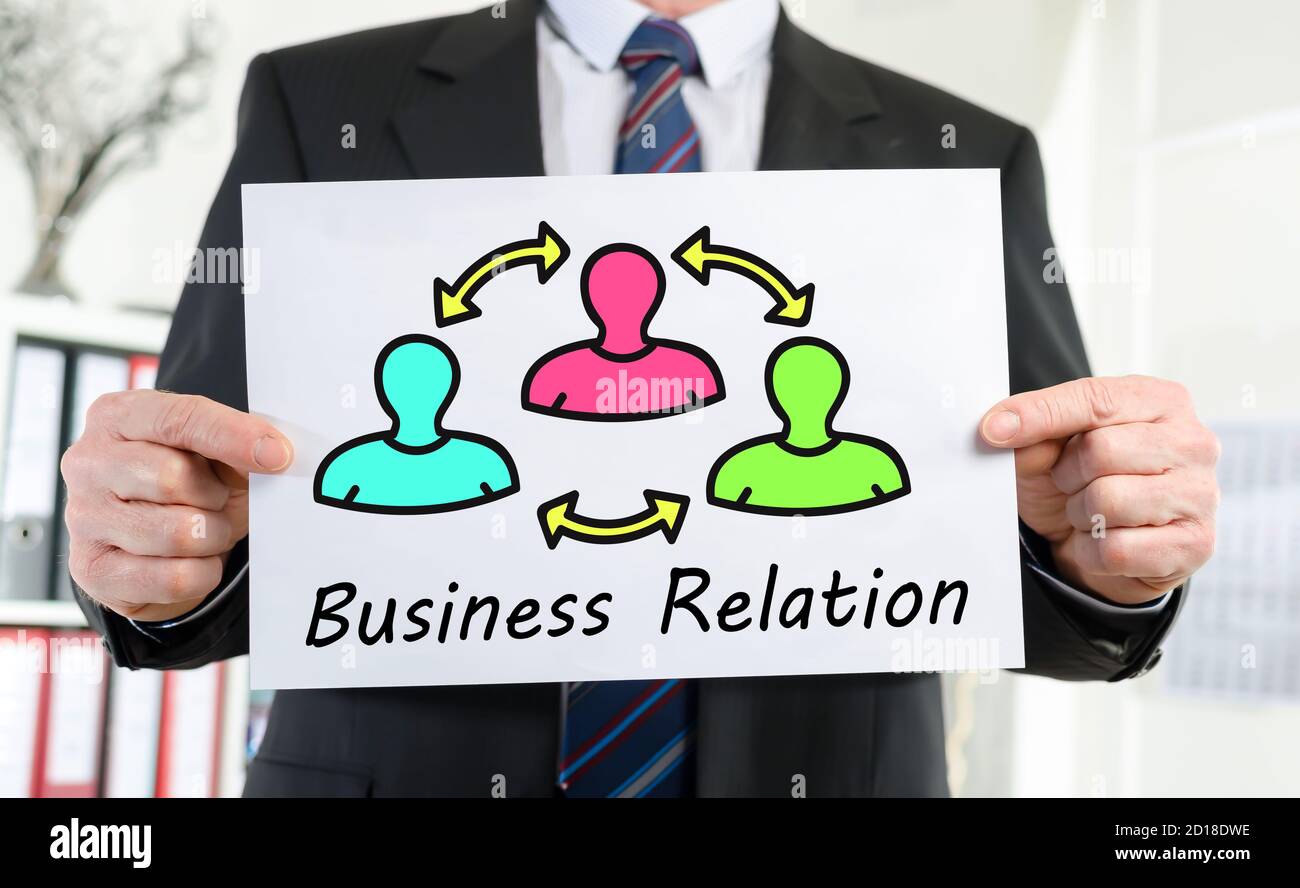 Paper showing business relation concept held by a businessman Stock ...