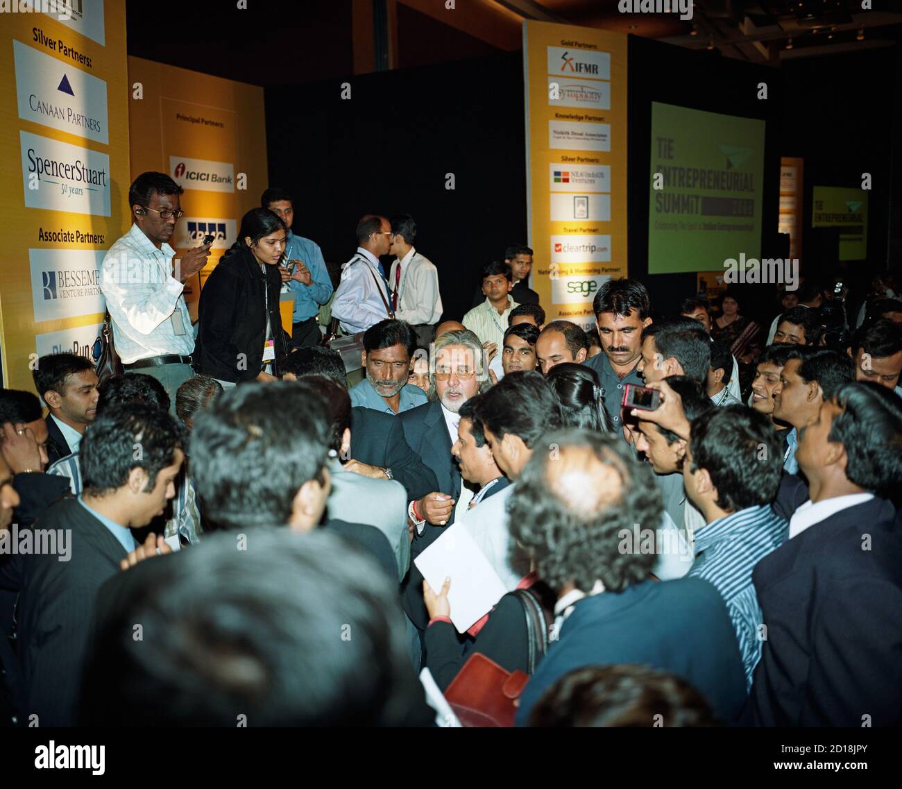 Crowds at a business convention in Bangalore crowd around Vijay Malla ...