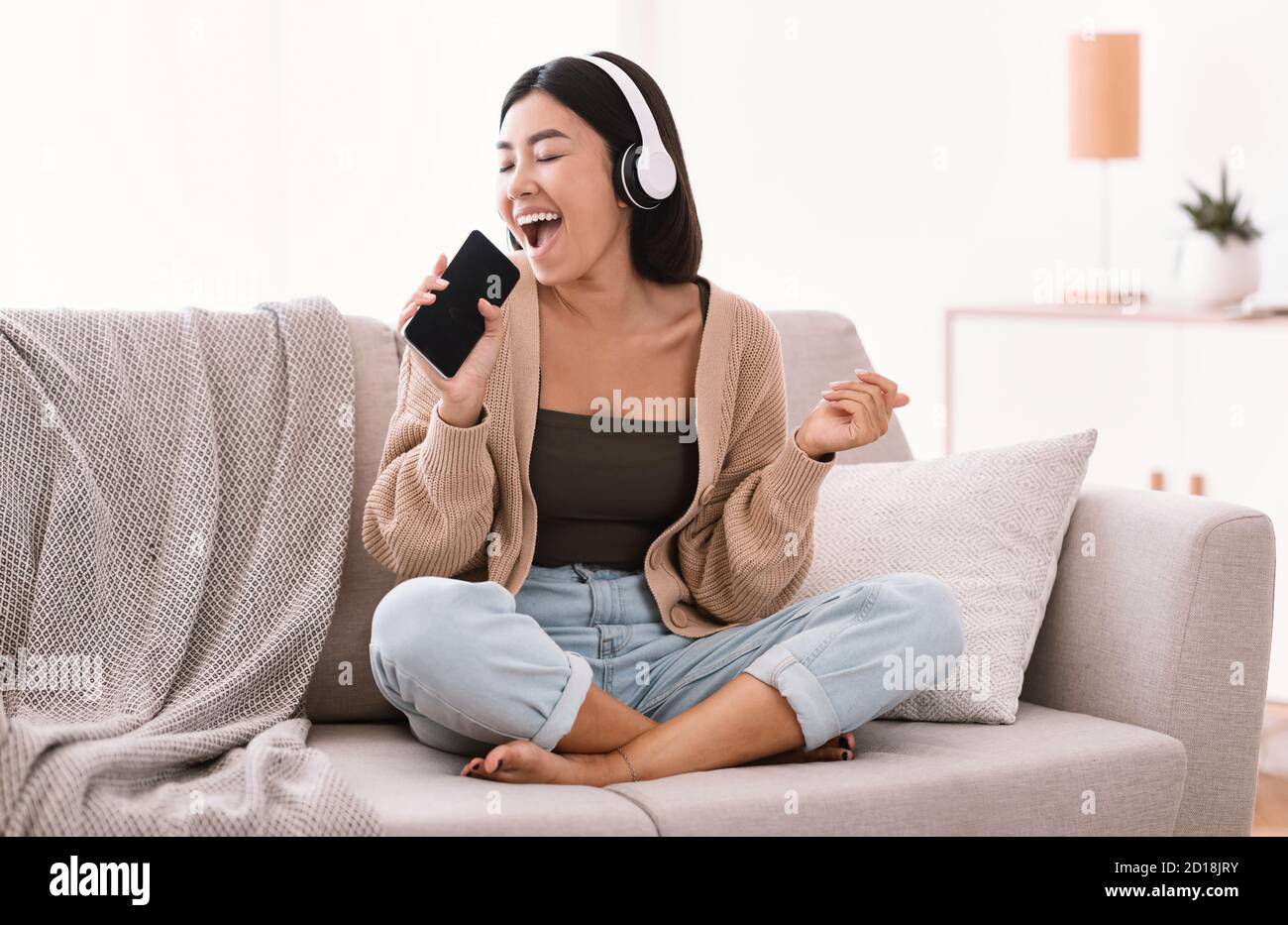Young asian woman fun singing hi-res stock photography and images - Alamy