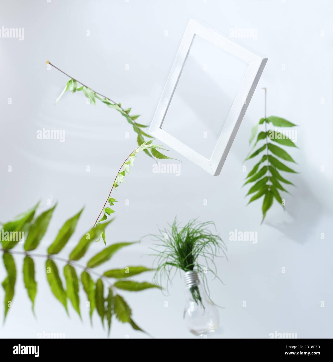 Beautiful flying green leaves background with white frame. Creative ...