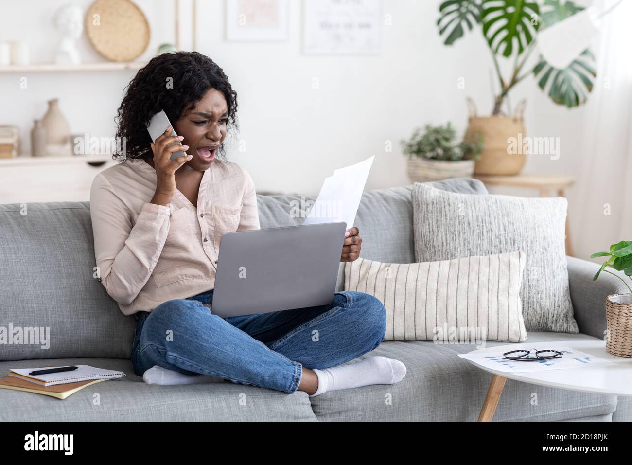 Remote Work Stress. Angry african woman having problems while working ...