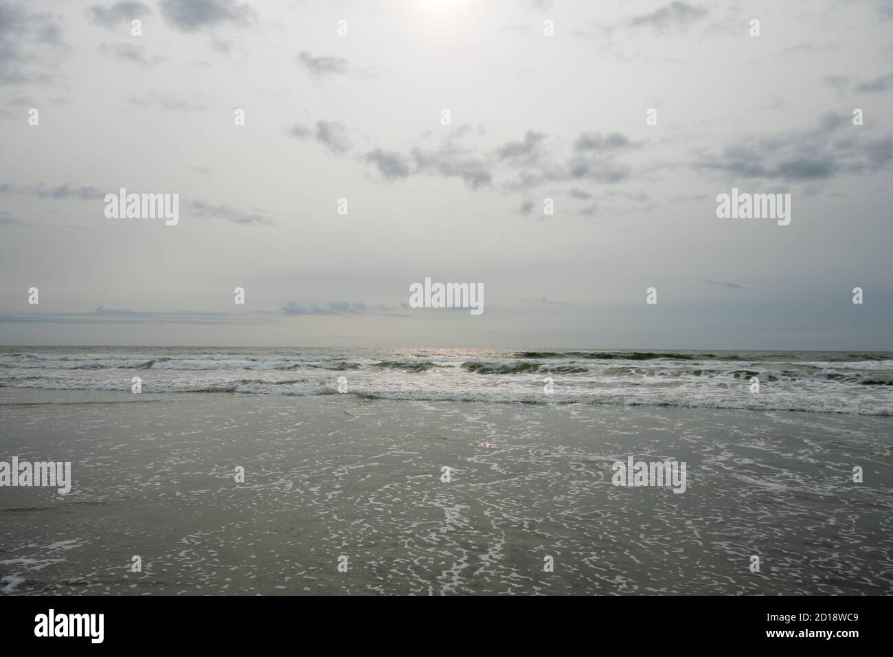 A View of the Horizon OVer the Ocean on a Beach on a Cloudy Grey Sky ...