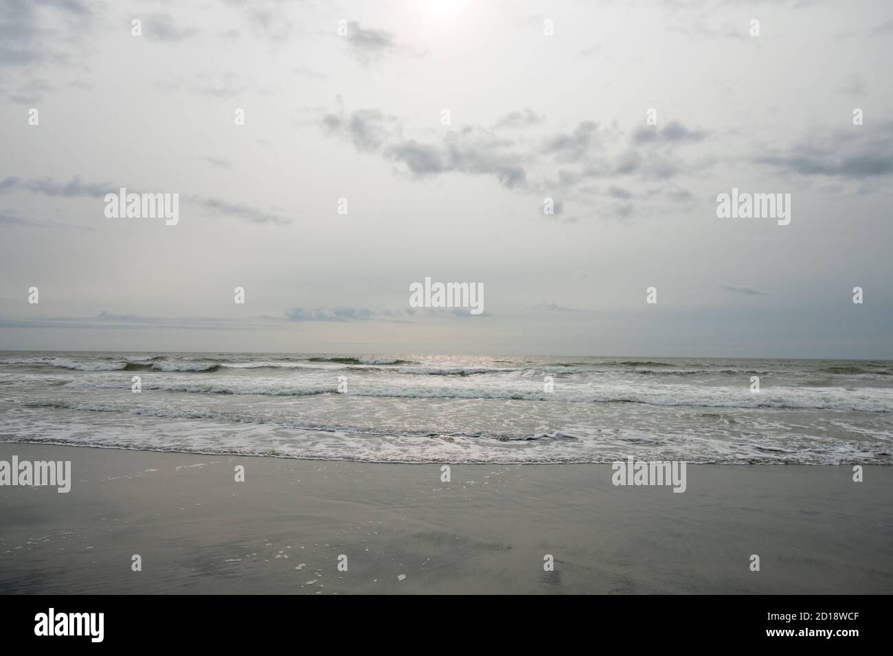 A View of the Horizon OVer the Ocean on a Beach on a Cloudy Grey Sky ...