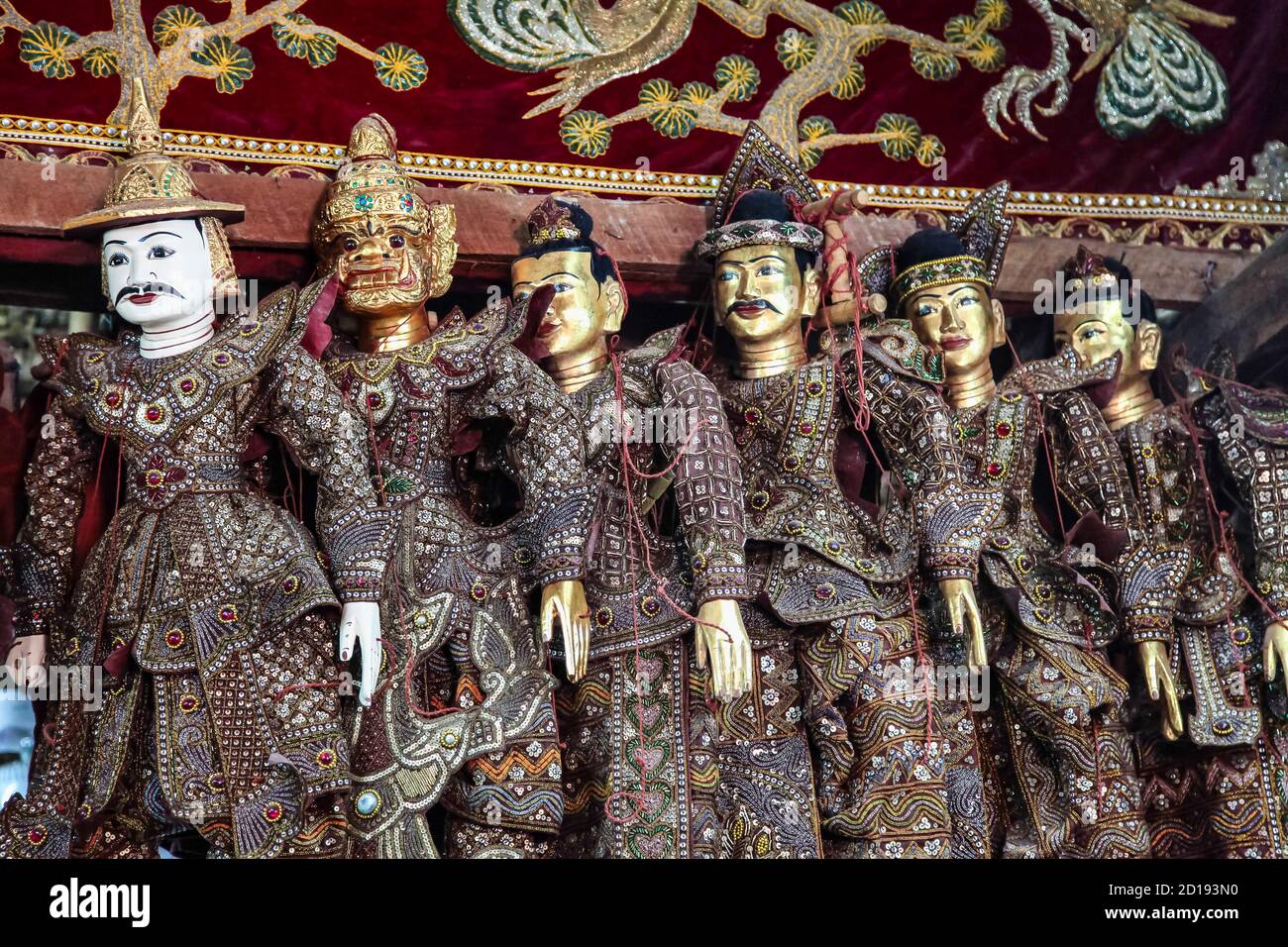 Traditional handicraft puppets are sold in a market at Mandalay ...
