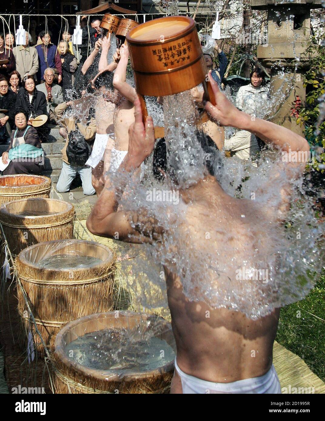 Buddhist monks pour water over hi-res stock photography and images - Alamy