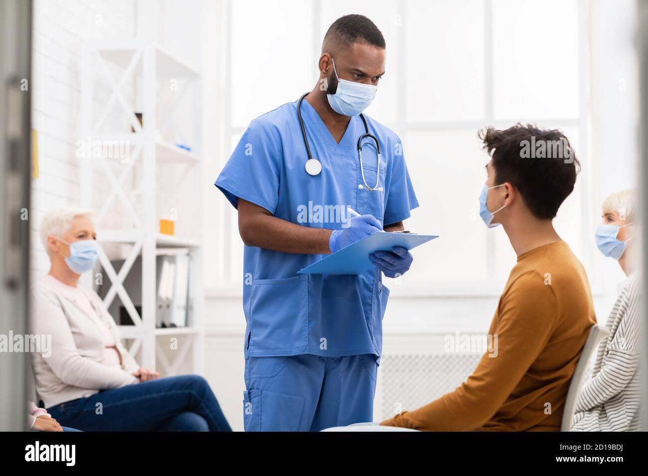African american doctor talking sick hi-res stock photography and ...