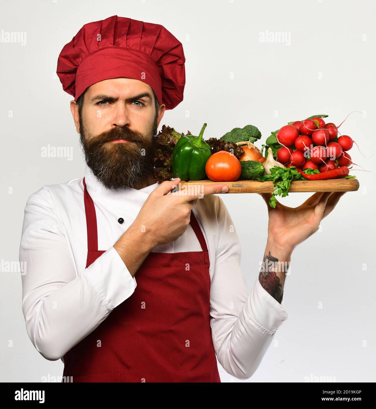 Cooking and vegetarian diet concept. Man with beard isolated on white ...