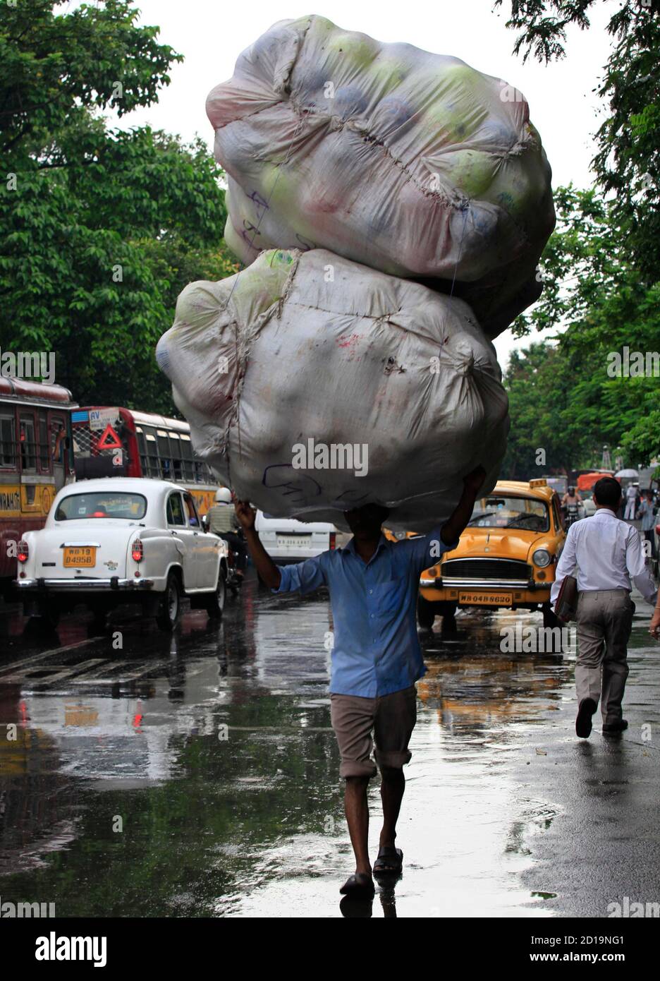 Indian man carrying sack rice hi-res stock photography and images - Alamy