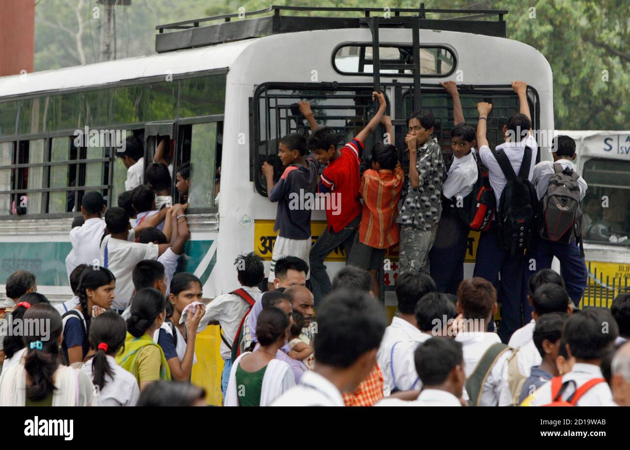 School children travel on over crowded hi-res stock photography and ...