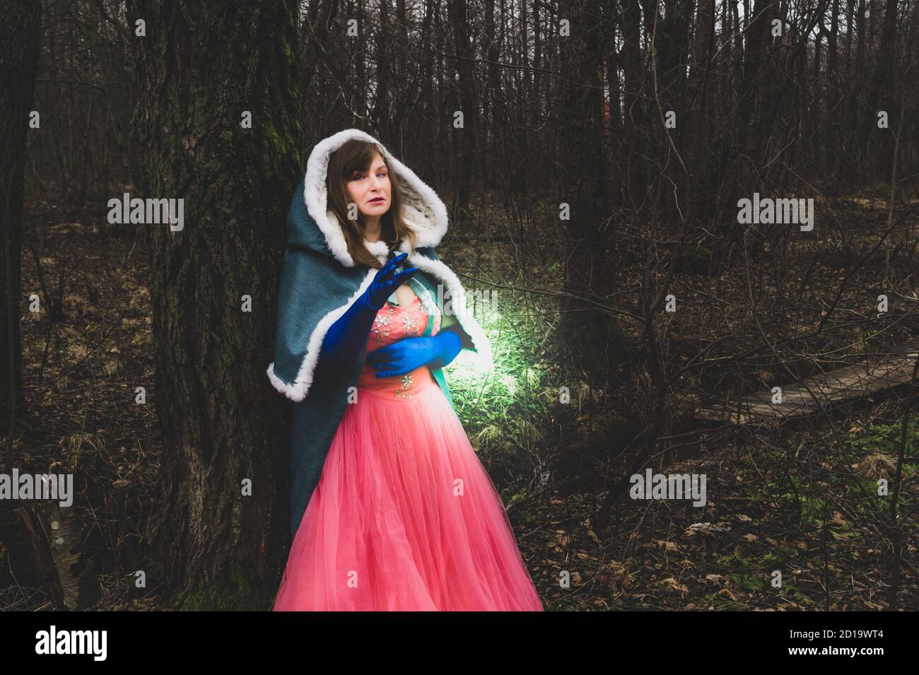 Sorceress casting a spell. woman in fantasy costume with cape leaned ...