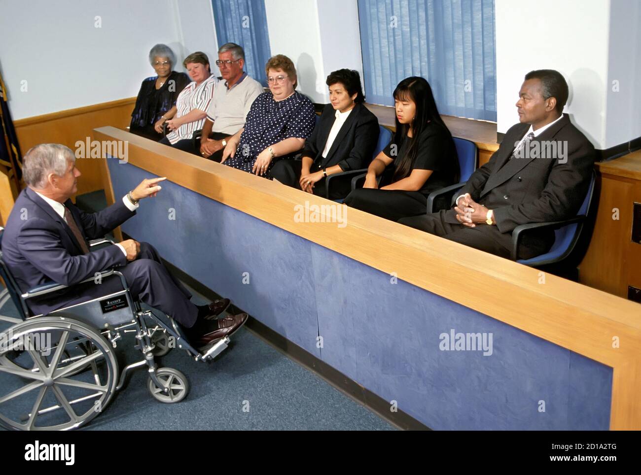 Lawyer Attorney in wheel chair addresses a mix race jury Stock Photo ...