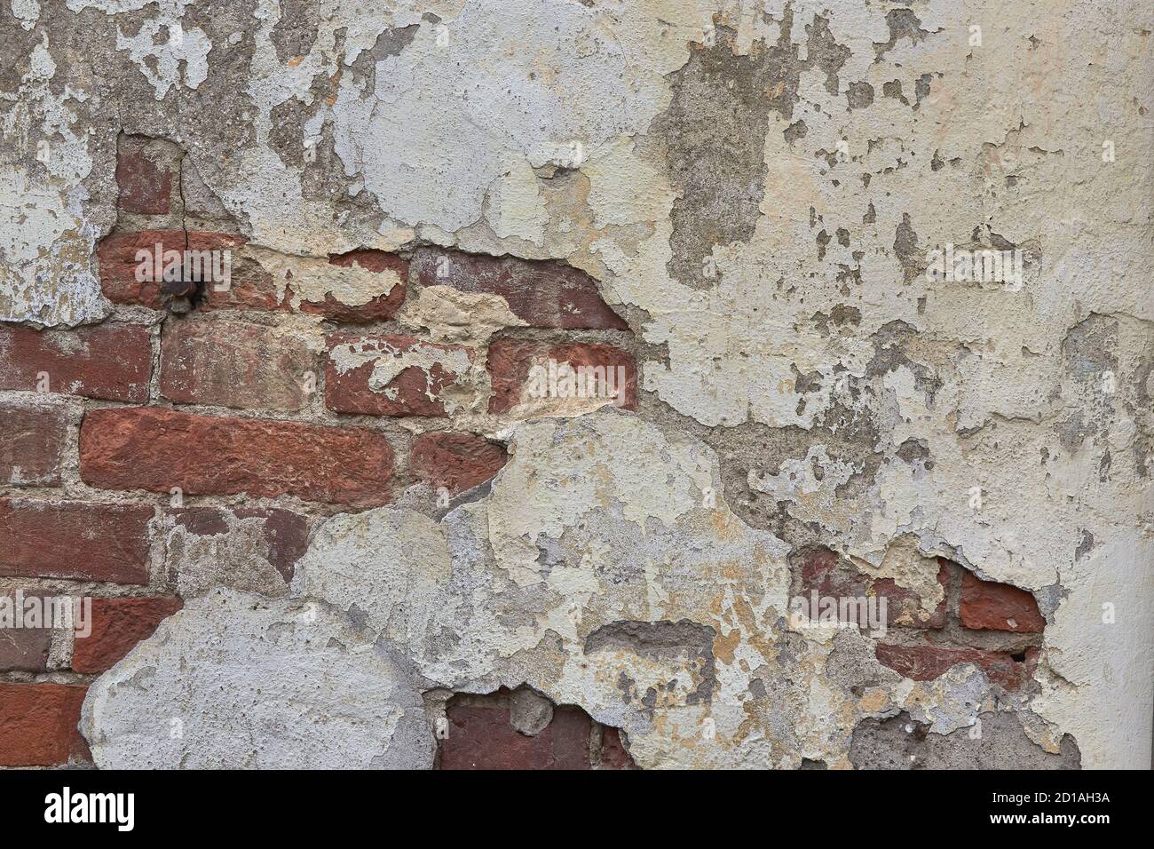 destroyed brick wall with fallen off plaster Stock Photo - Alamy