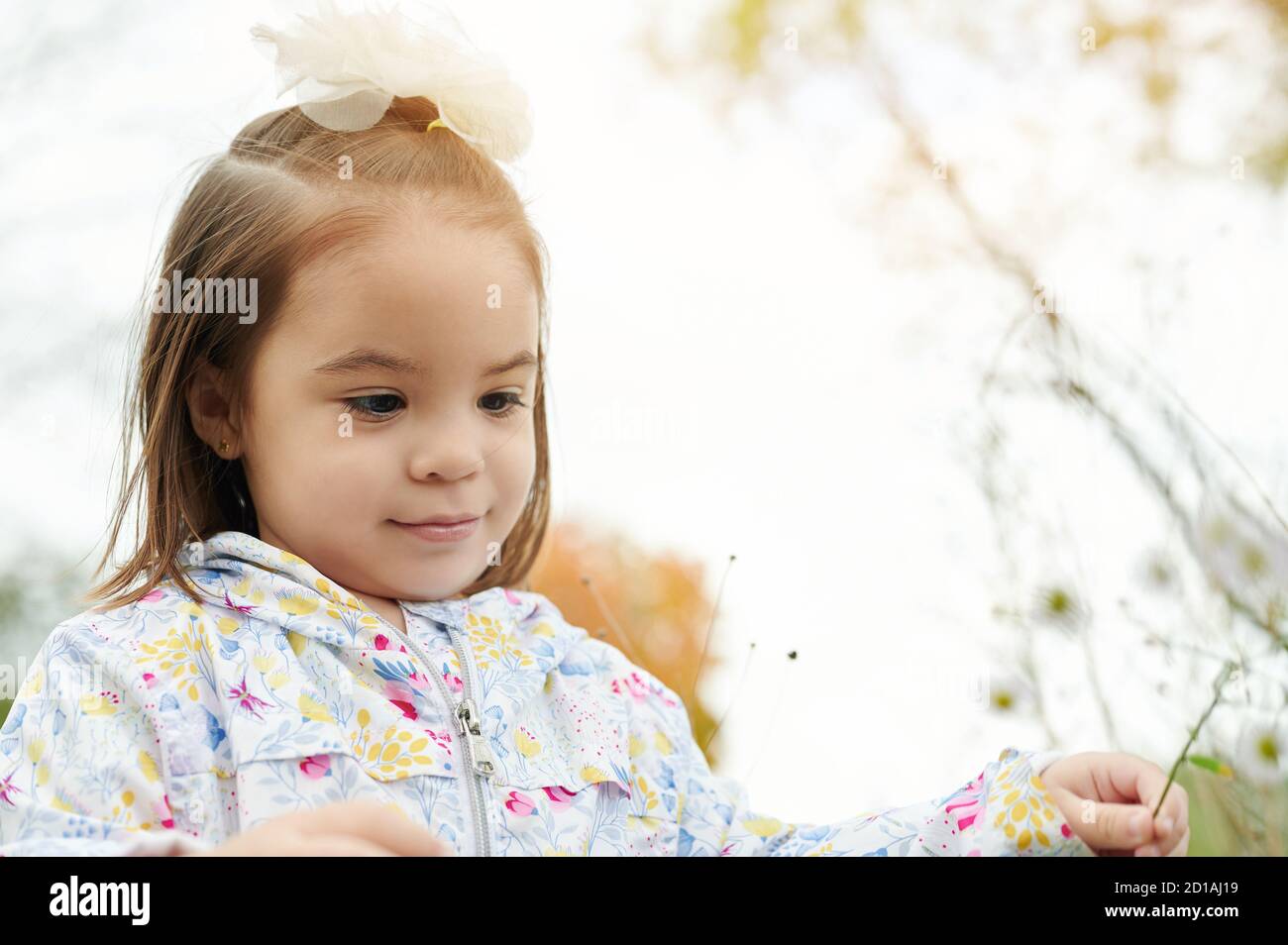 Kid girl play outside on nature background. Spend time with kids theme ...