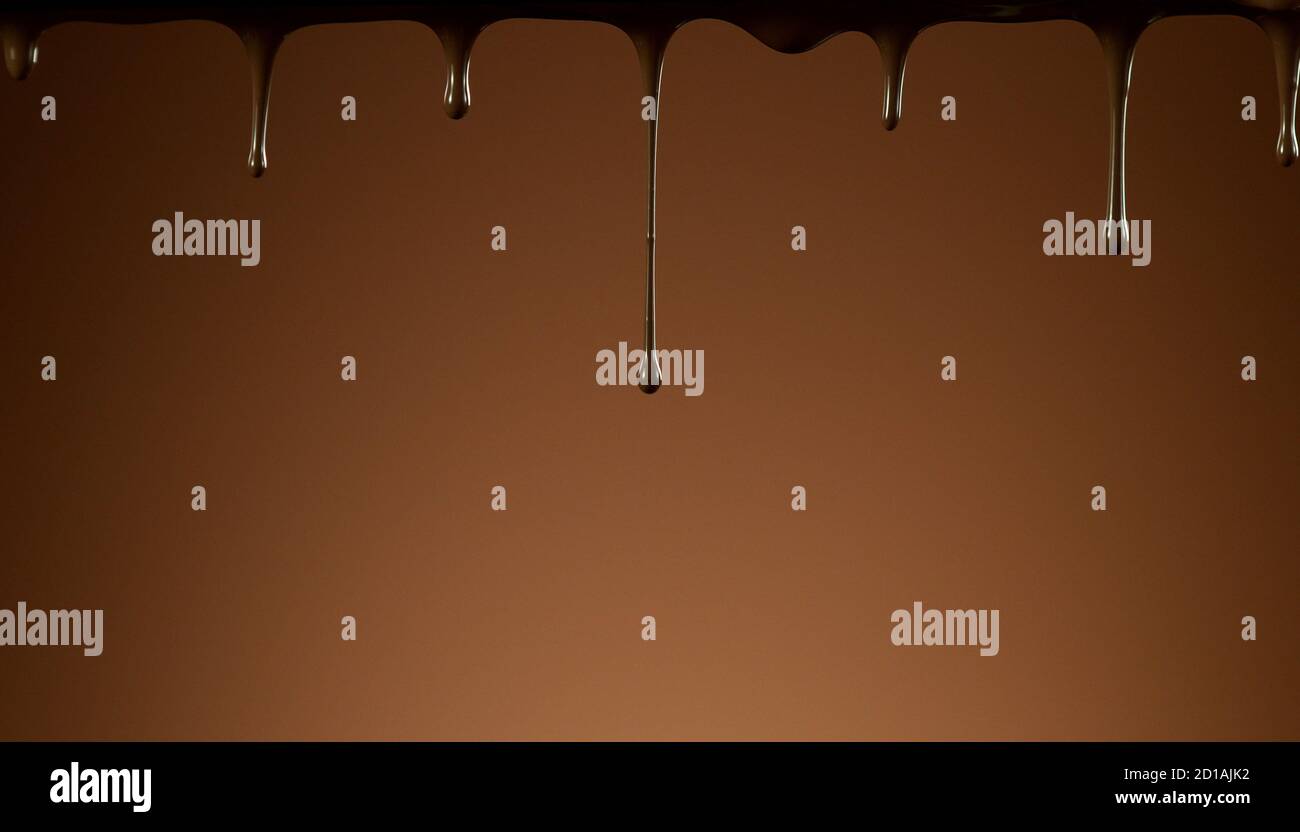 Dripping melted chocolate on soft background, abstract background Stock ...