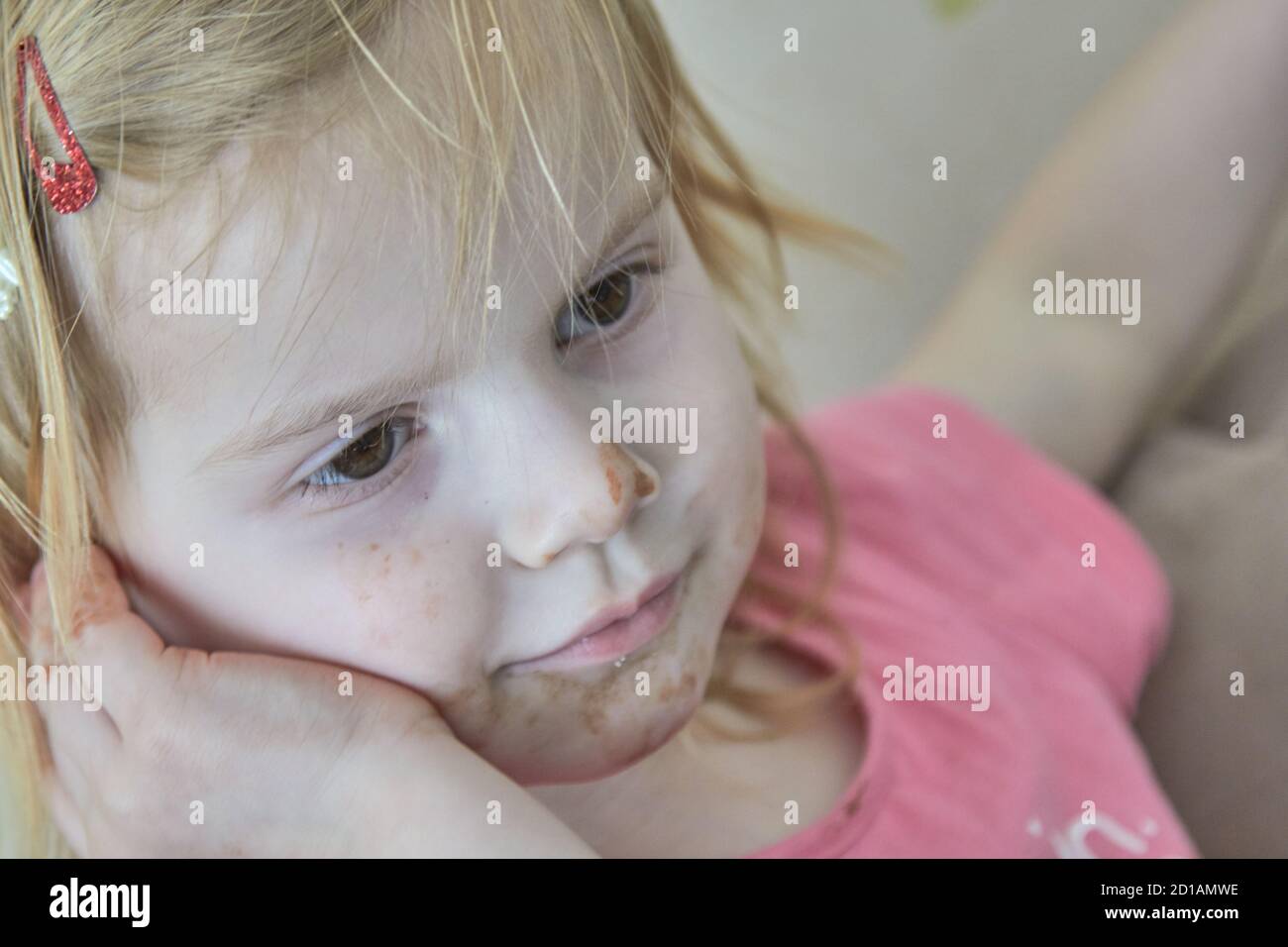 beautiful baby with a spot of ice cream on her face Stock Photo - Alamy