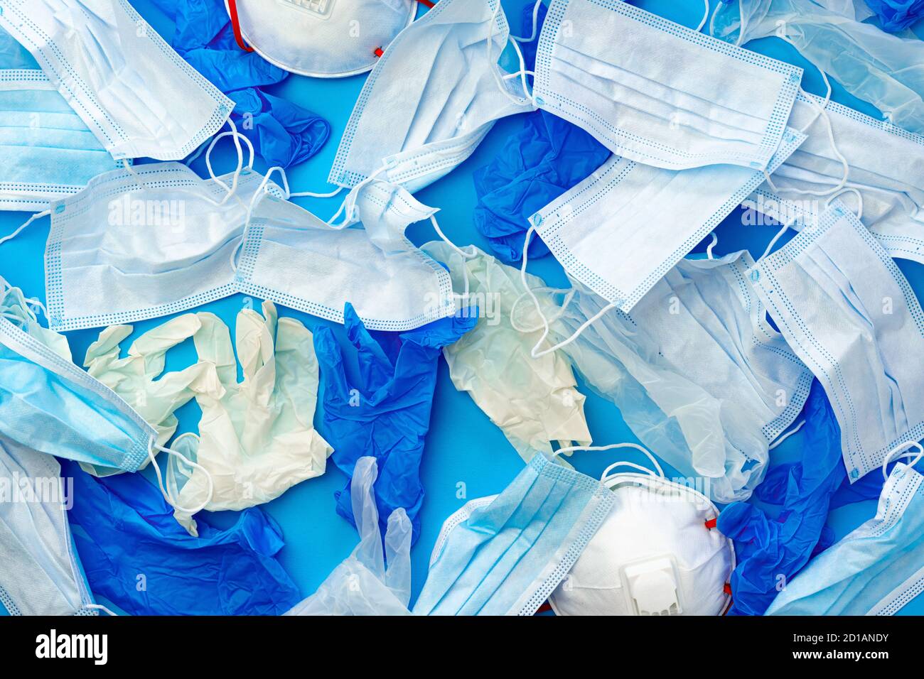 Coronavirus protection equipment in medical waste bin. Used face masks ...
