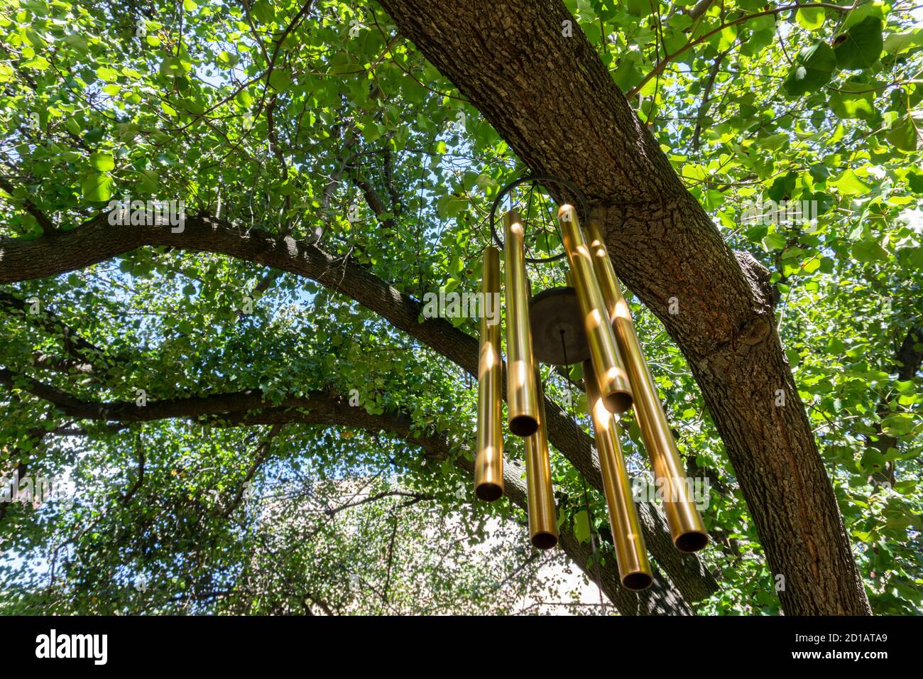 Golden wind chimes hanging hi-res stock photography and images - Alamy
