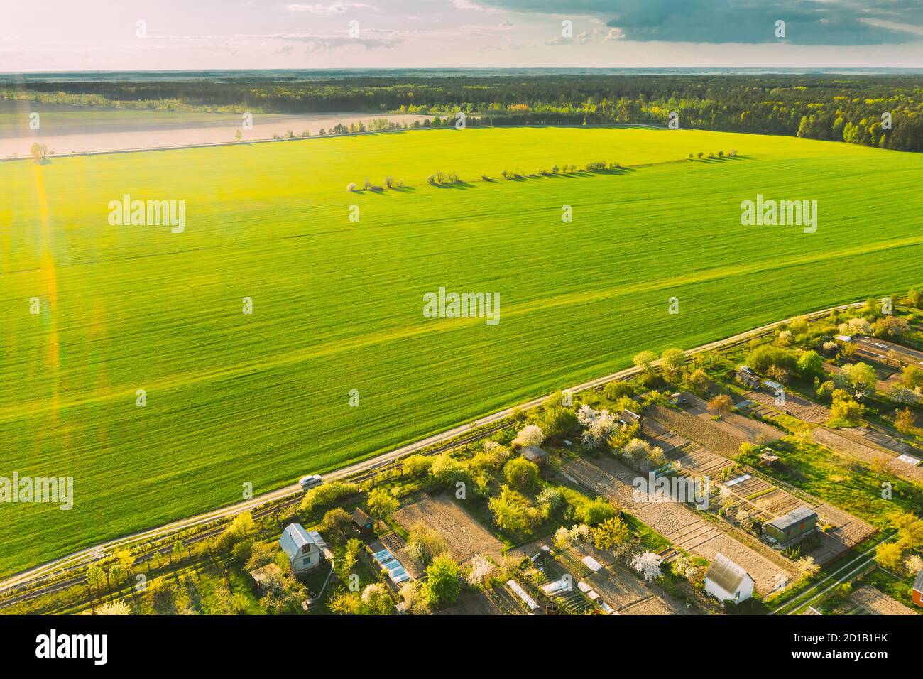 Countryside Rural Landscape With Small Village, Gardens And Green Field ...
