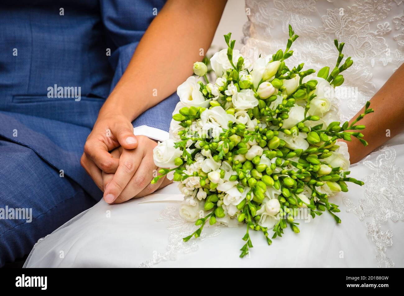 Bride and groom, hand in hand at the wedding ceremony Stock Photo - Alamy