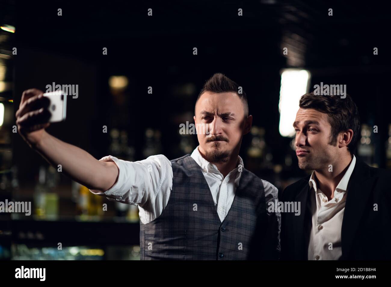 male friends call from a video from a nightclub Stock Photo - Alamy