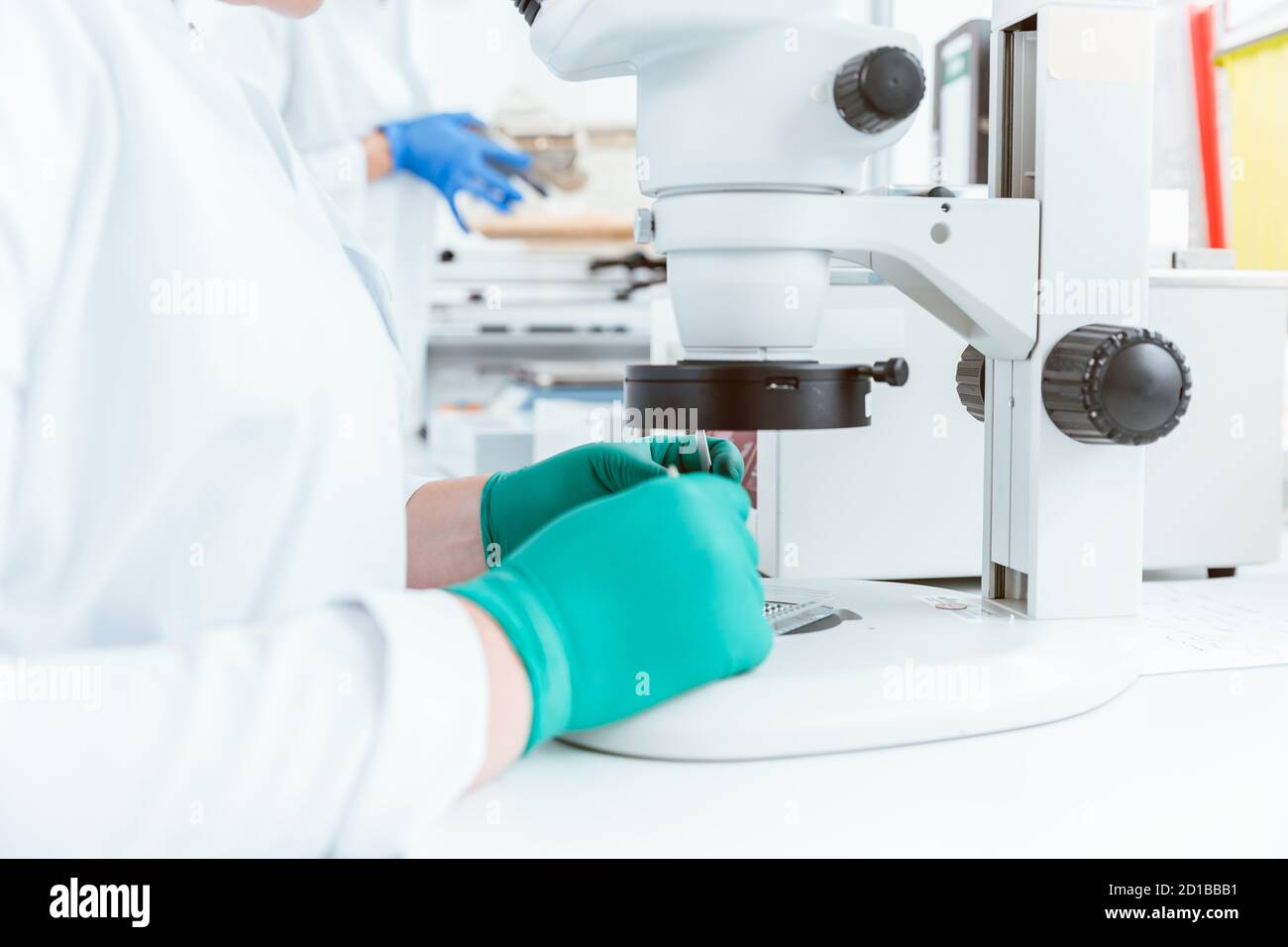 Scientist hand using microscope Stock Photo - Alamy