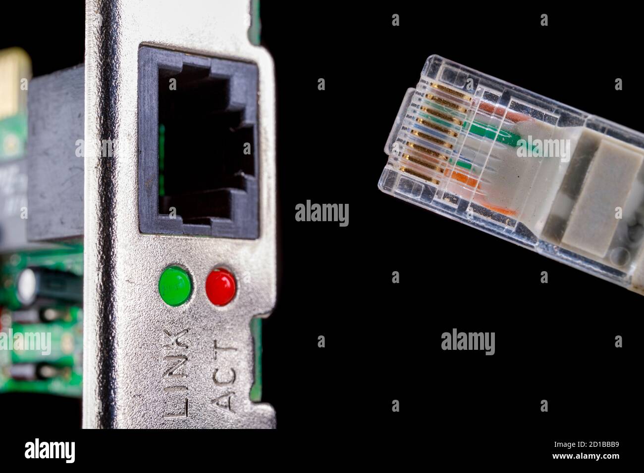Rj45 cable and network card slot. Cable for data transmission in a ...