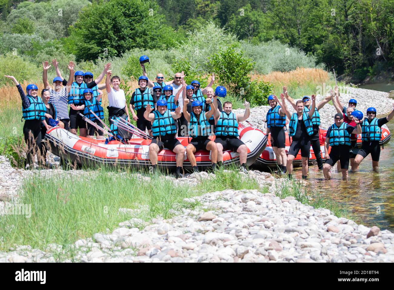 Happy rafting team prepared for the start Stock Photo - Alamy