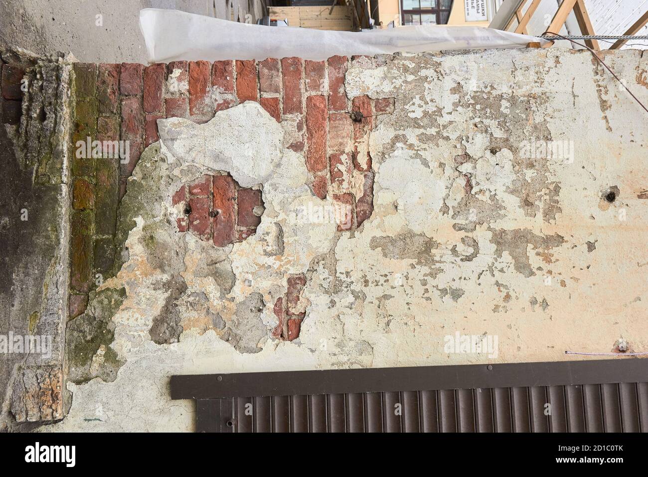 destroyed brick wall with fallen off plaster Stock Photo - Alamy