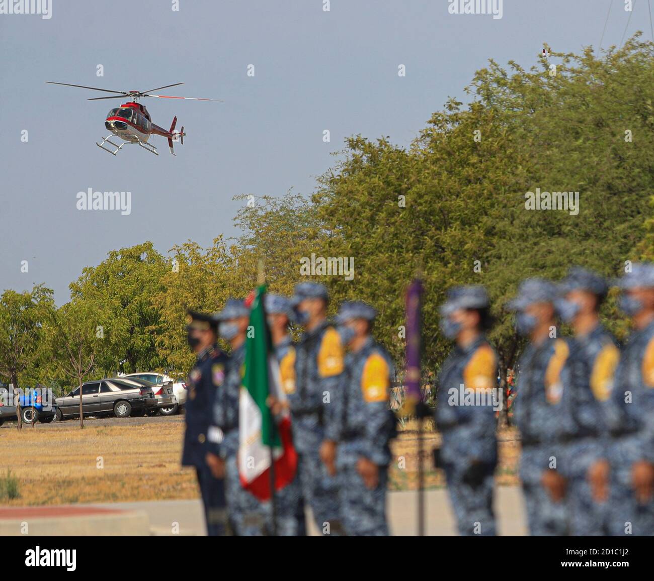 helicopter lands, during the military ceremony for the taking of ...