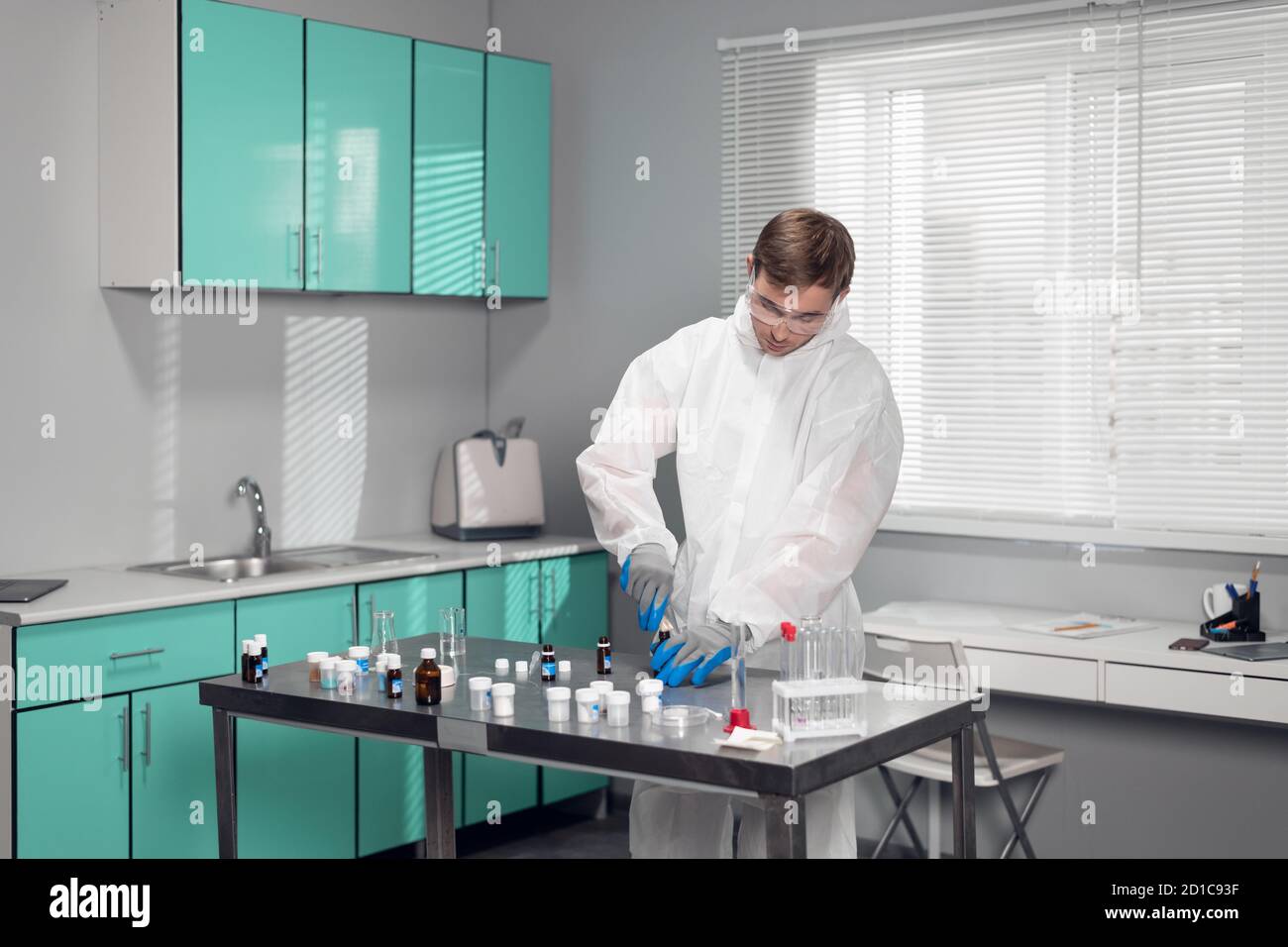 Student in the lab. Young male chemist working in the laboratory Stock ...