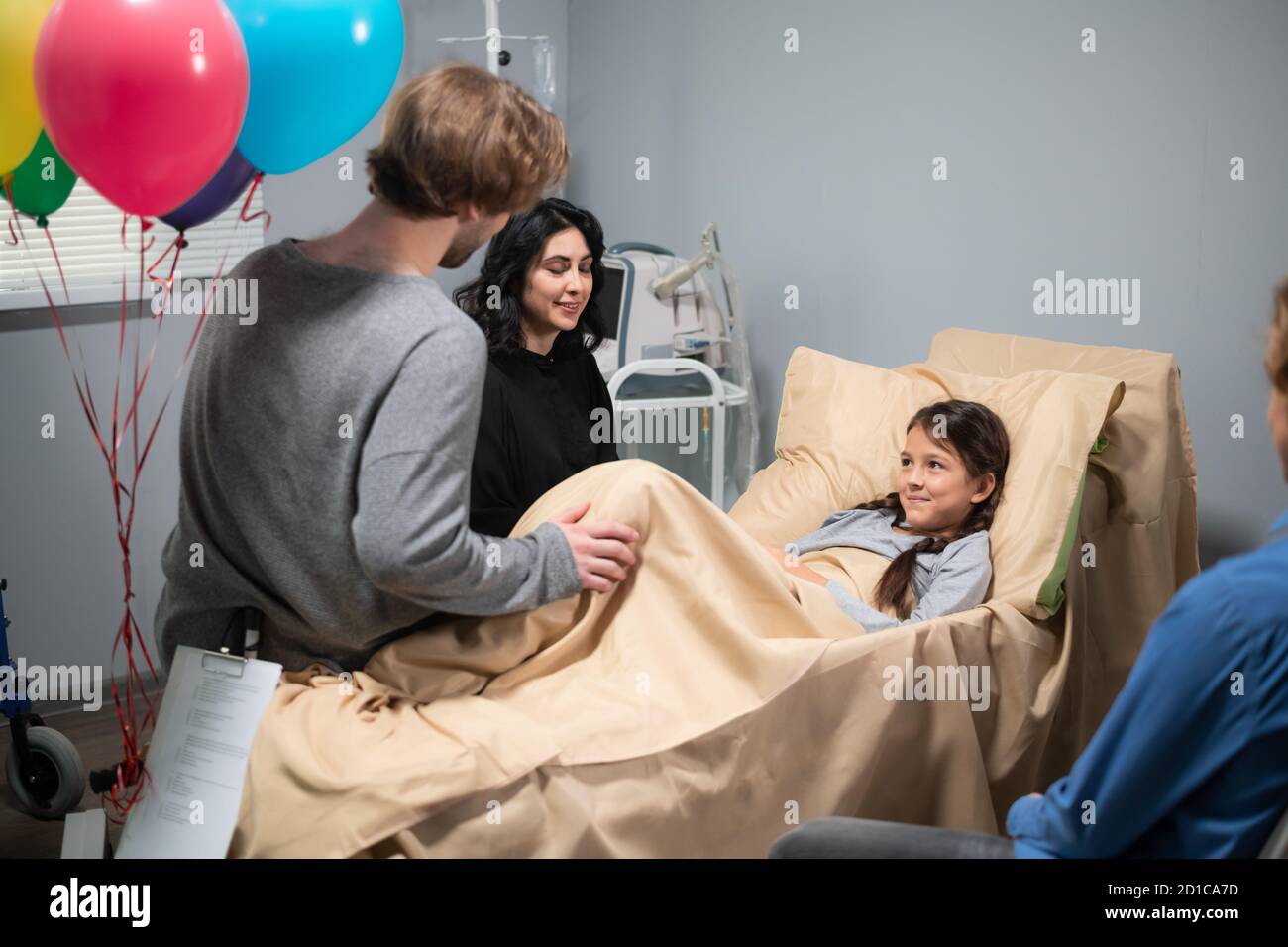 An elder brother visiting his little sister at the hospital Stock Photo ...