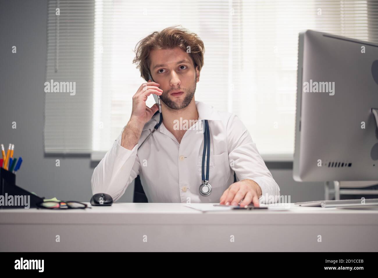 Serious telephone nurse hi-res stock photography and images - Alamy