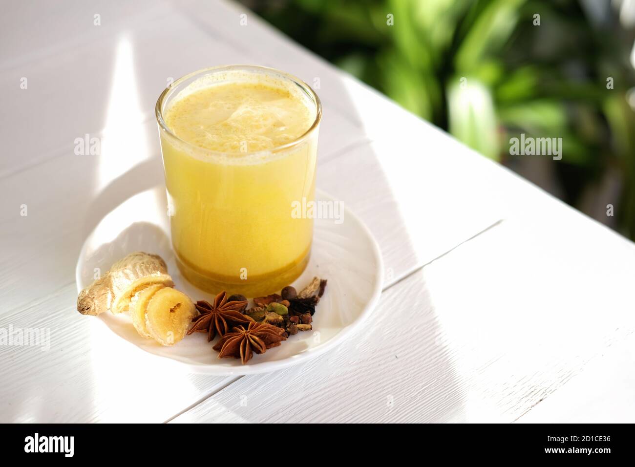 Traditional Indian drink. turmeric milk or golden milk with cloves ...