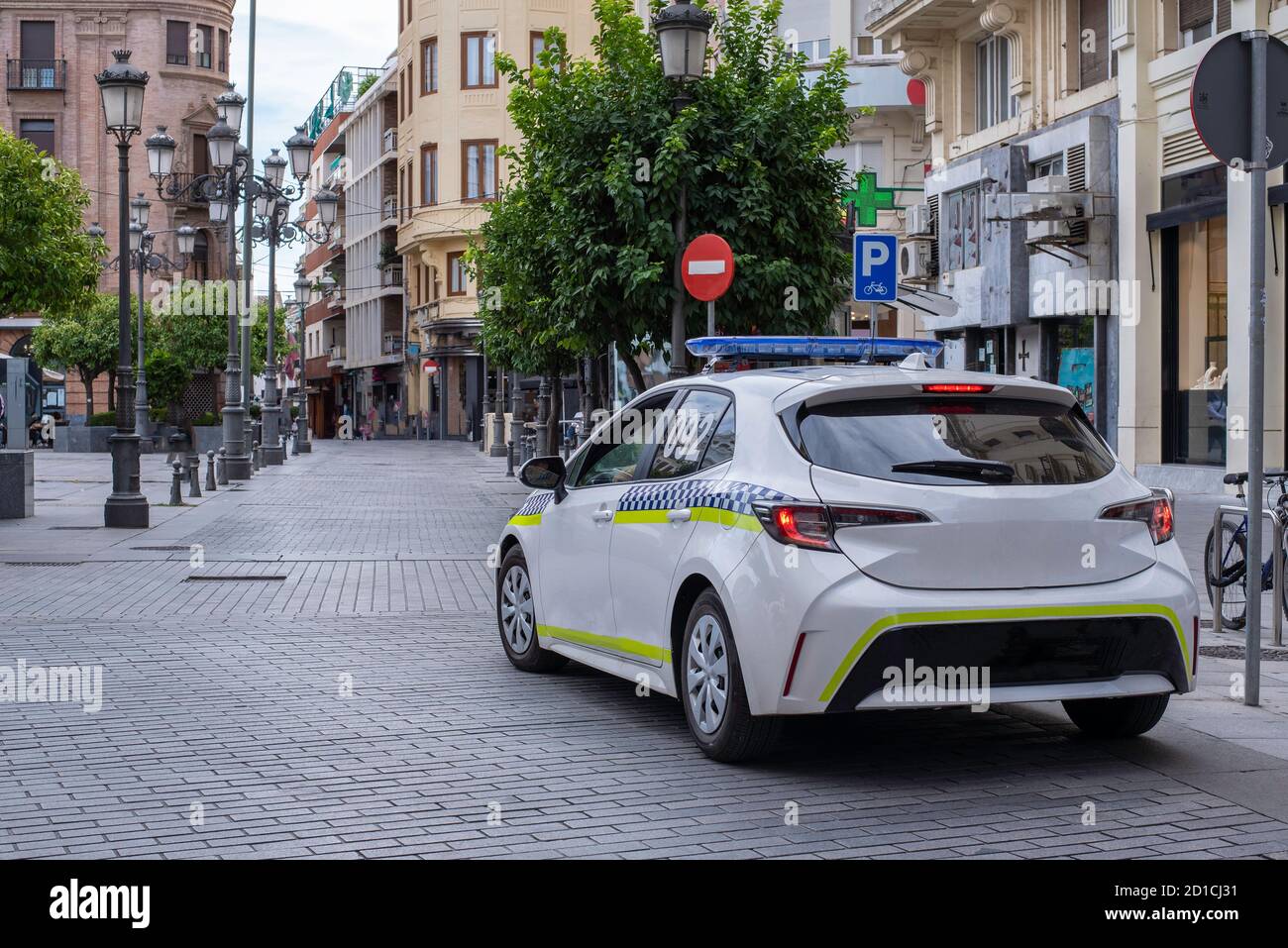 Police car patrolling the city in a pedestrian zone Stock Photo - Alamy