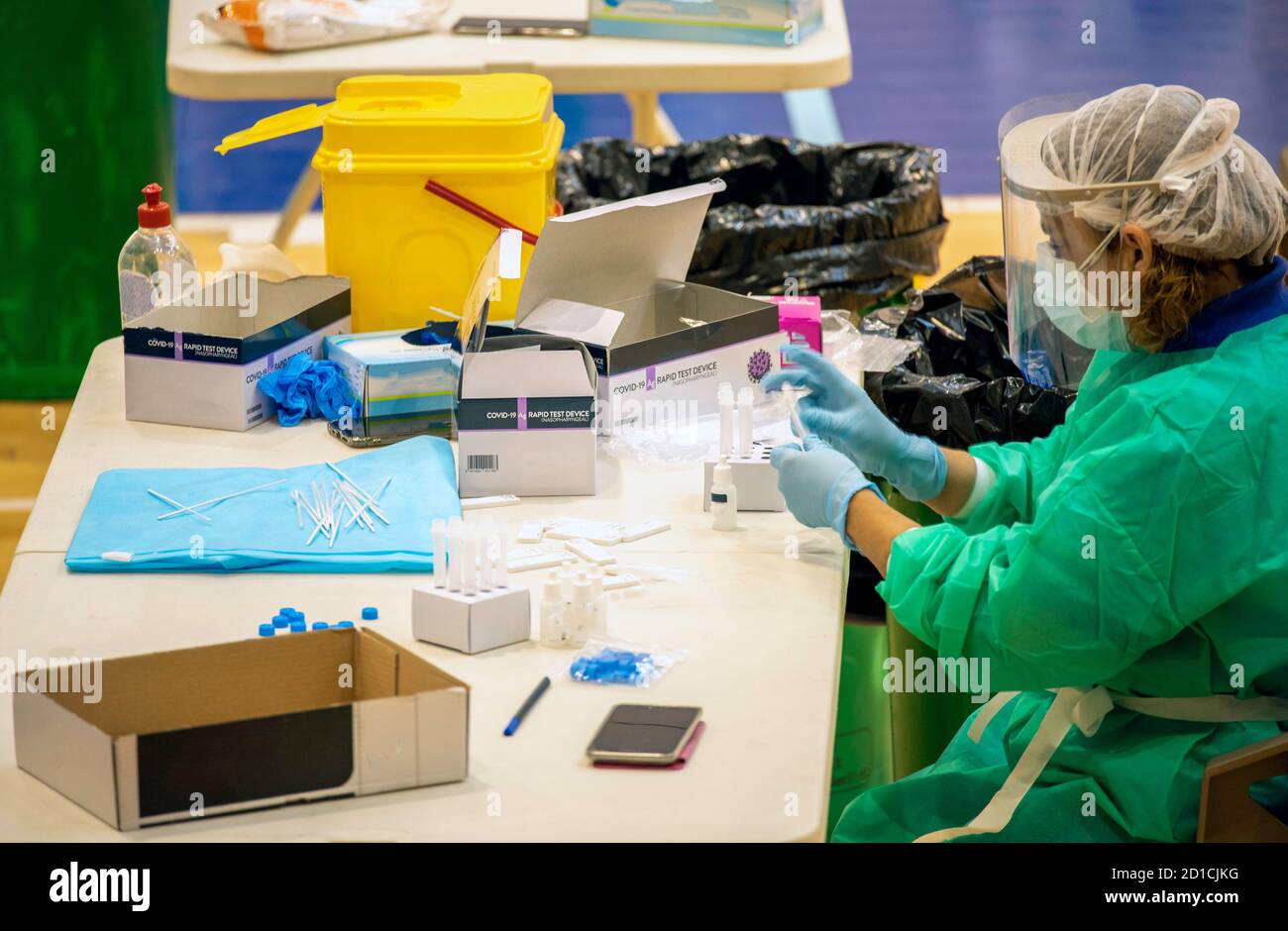 Seated nurse handling different nursing supplies Stock Photo - Alamy