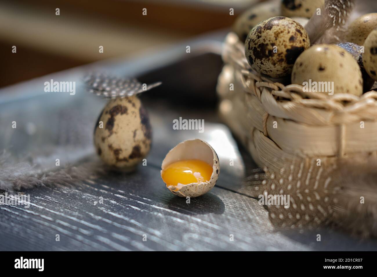 organic farmer quail eggs in woven basket and on wooden table. rustic ...