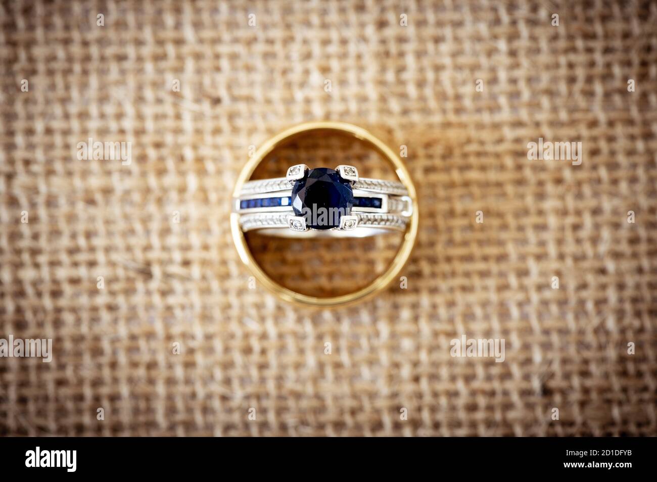 Overhead shot of wedding rings on blurred background Stock Photo - Alamy