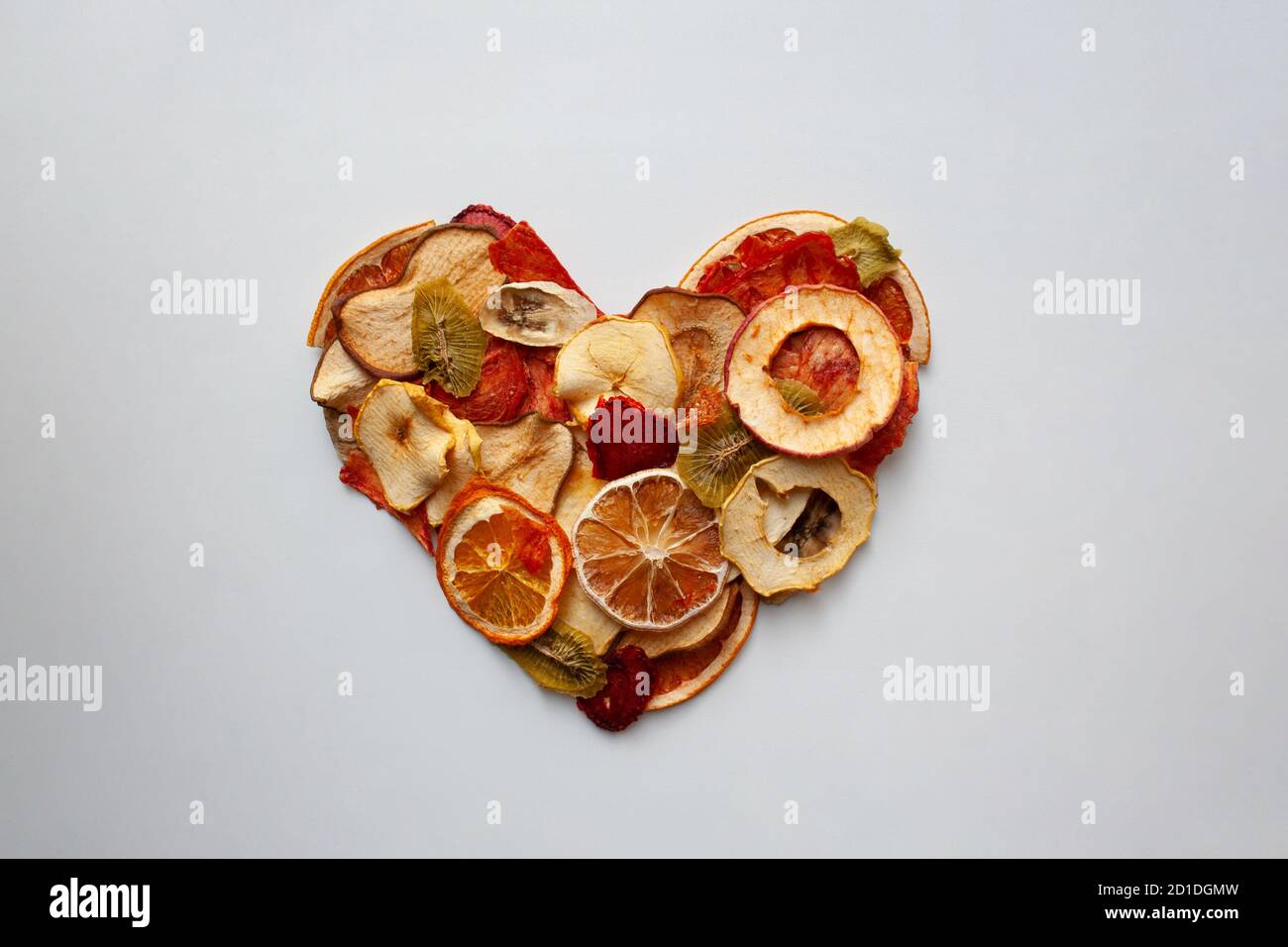Colorful dried fruit slices heart isolated on white background Stock ...