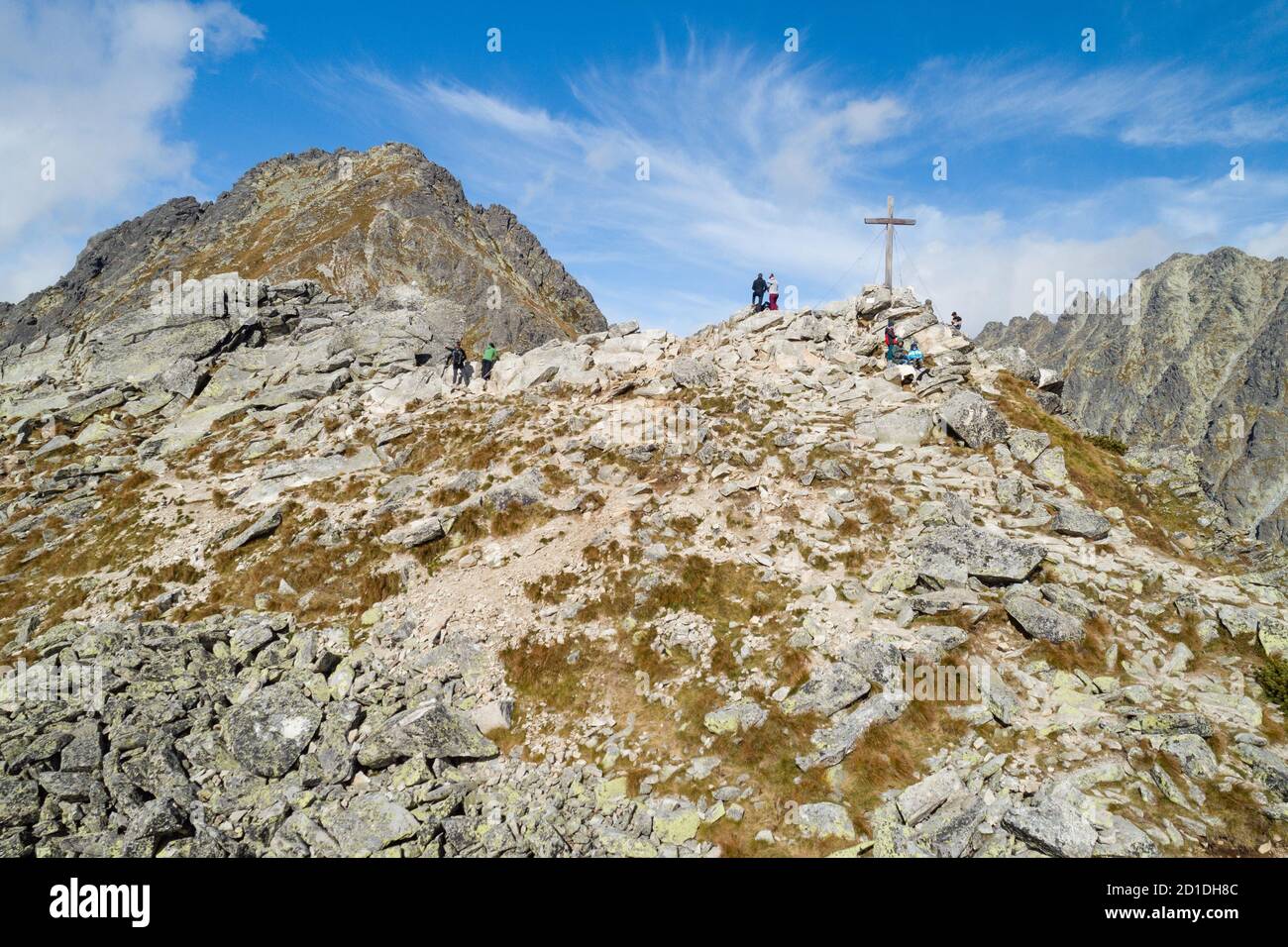 Aerial view of Predne Solisko peak with wooden cross on top, High ...